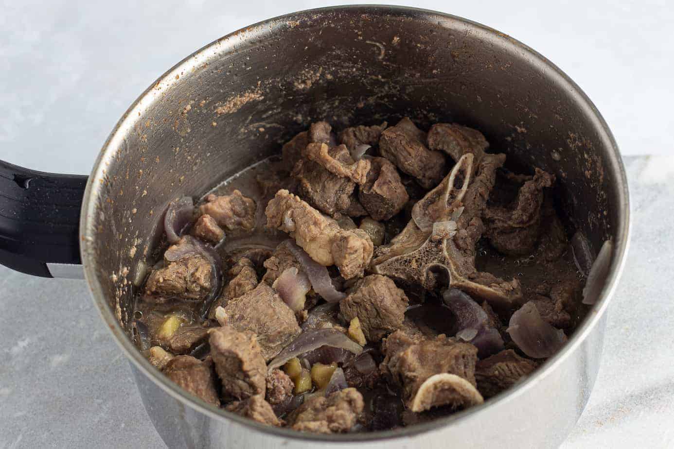 Asun (Peppered Goat Meat) Warm Salad Recipe · eat well abi